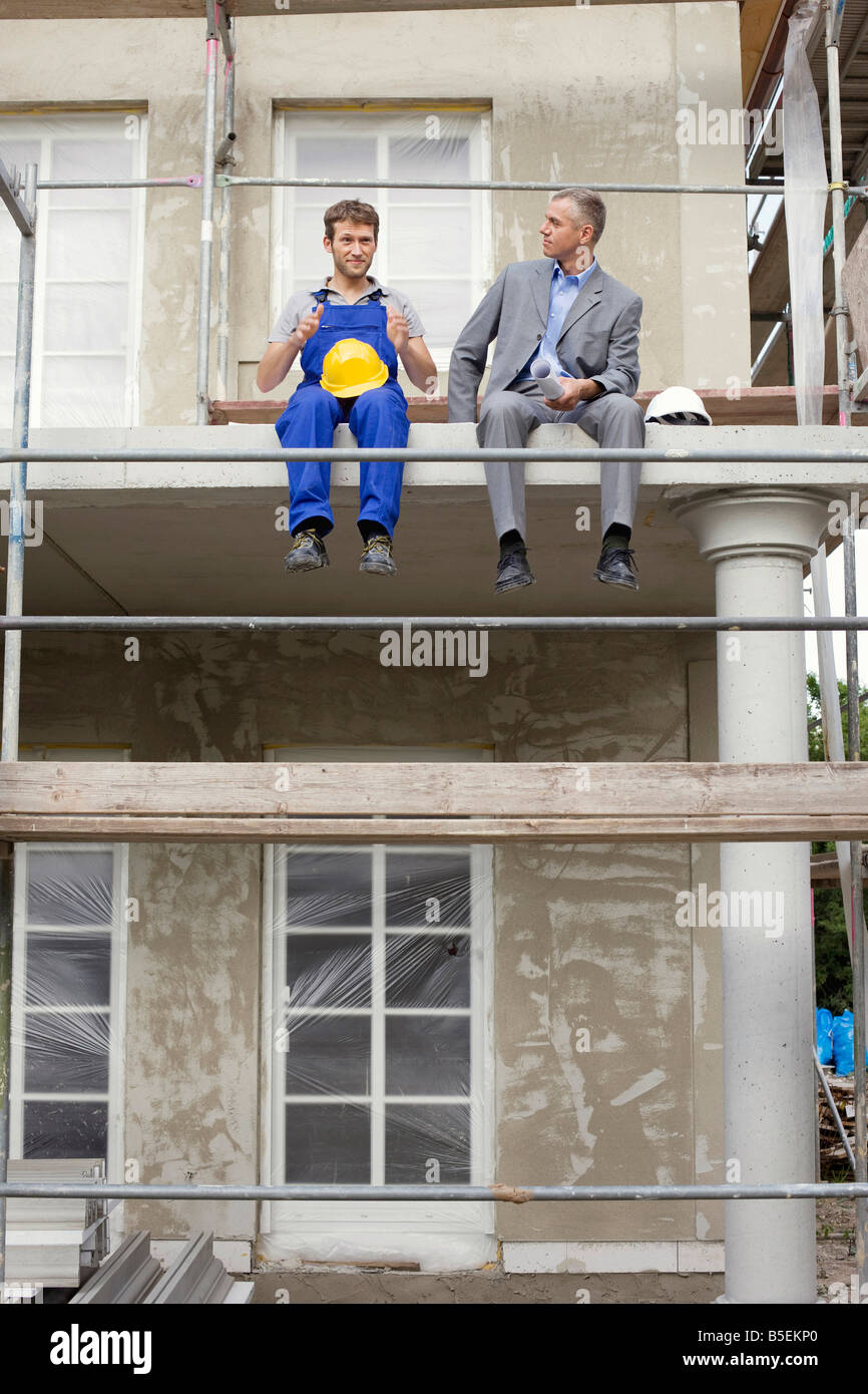 Architect and construction worker on site Stock Photo - Alamy
