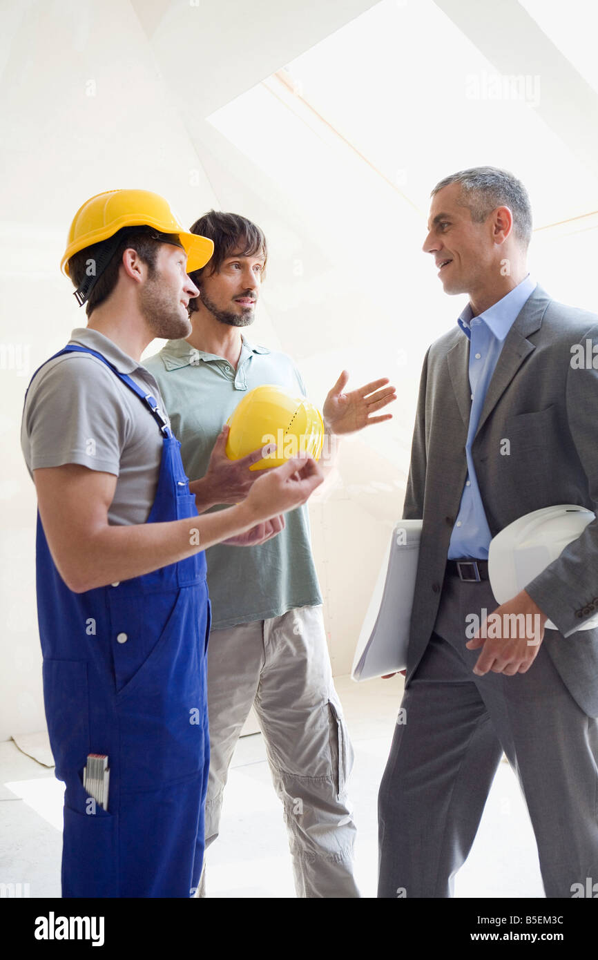 Construction conversation suit hardhat hi-res stock photography and ...