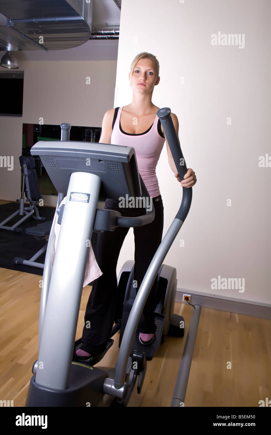 young woman training on Stairmaster Stock Photo - Alamy