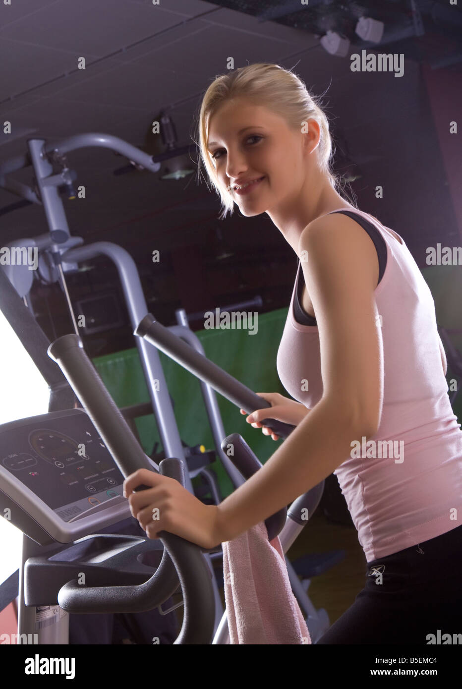 young woman training on Stairmaster Stock Photo - Alamy