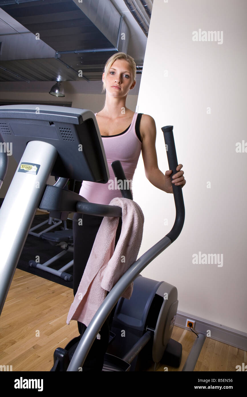 young woman training on Stairmaster Stock Photo - Alamy