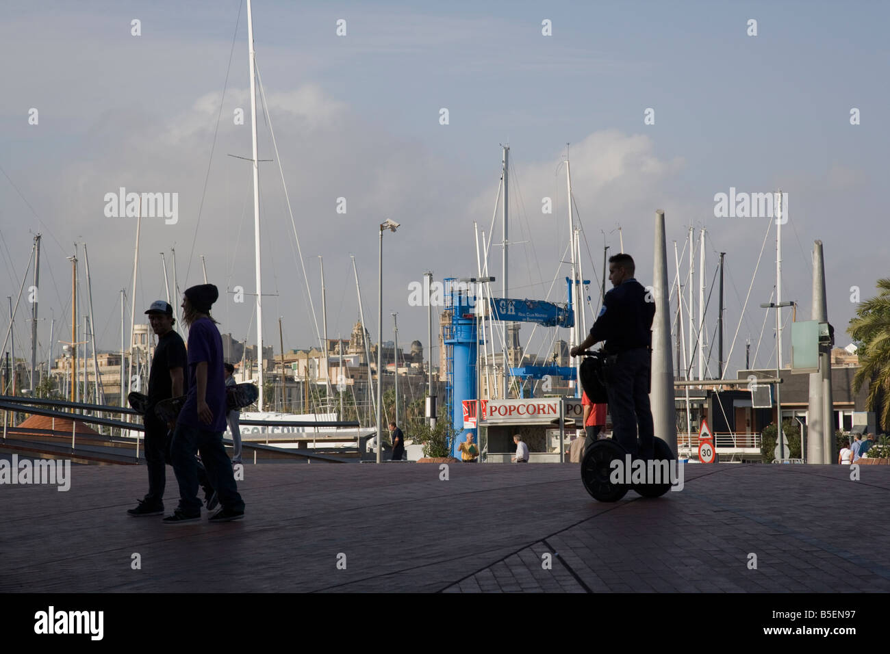 Security guard on a segway two wheeled electric scooter sees off two ...