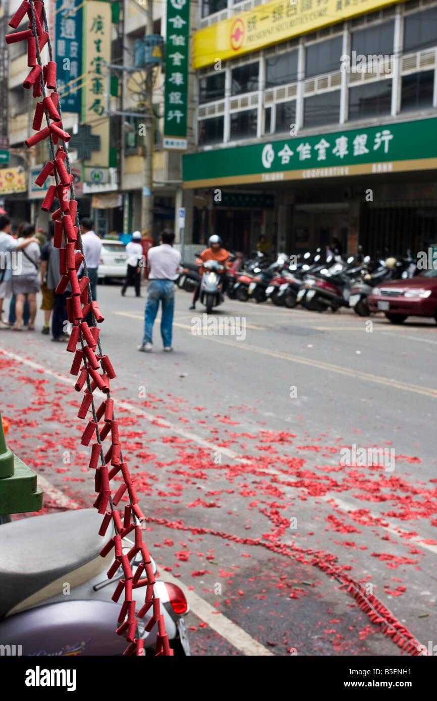 Red firecrackers line the road at the Mazu, Goddess of the Sea ...