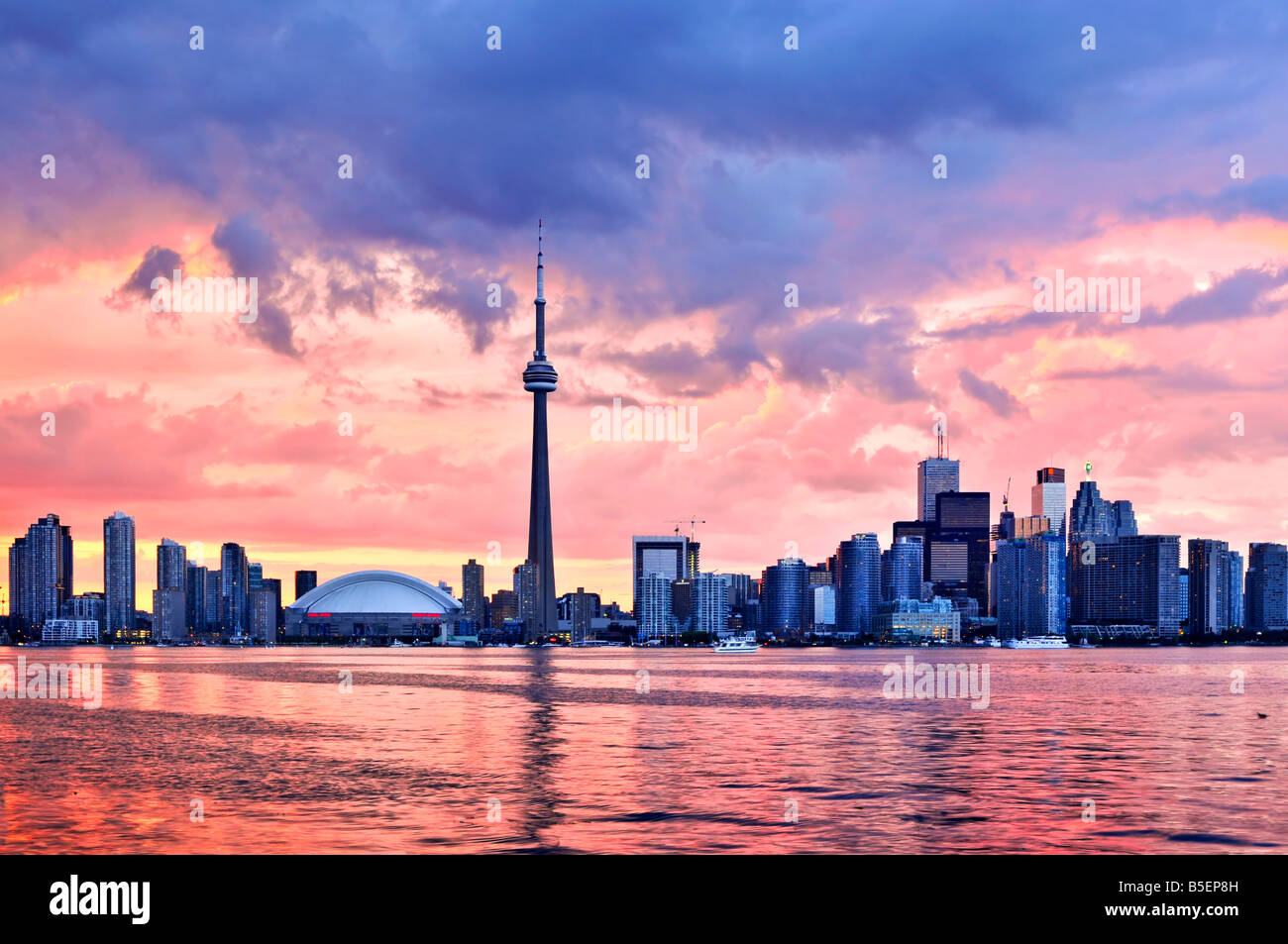Scenic view at Toronto city waterfront skyline at sunset Stock Photo ...