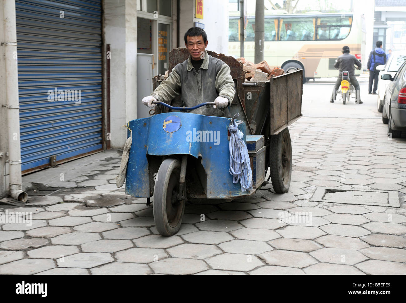Man driving a loaded tricycle, Suzhou, China Stock Photo - Alamy