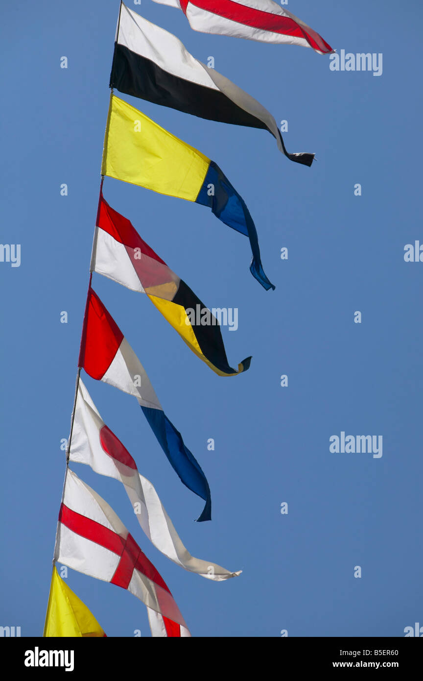 Signal flags against blue sky Stock Photo - Alamy