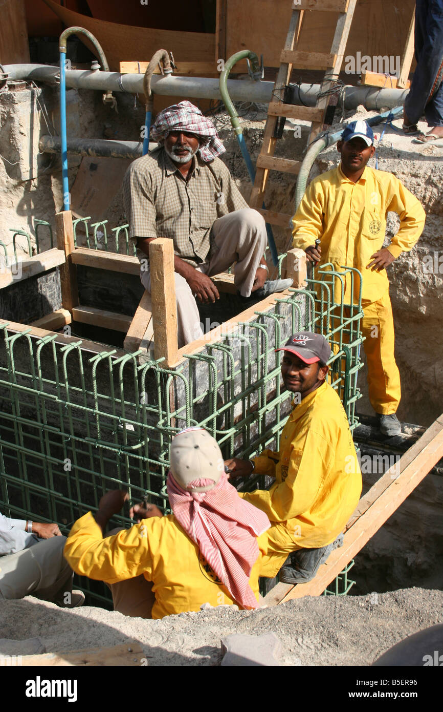 Construction Workers Abu Dhabi UAE Streetscene Stock Photo - Alamy
