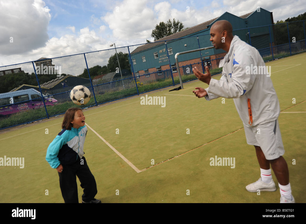 Kids playing football uk hi-res stock photography and images - Alamy