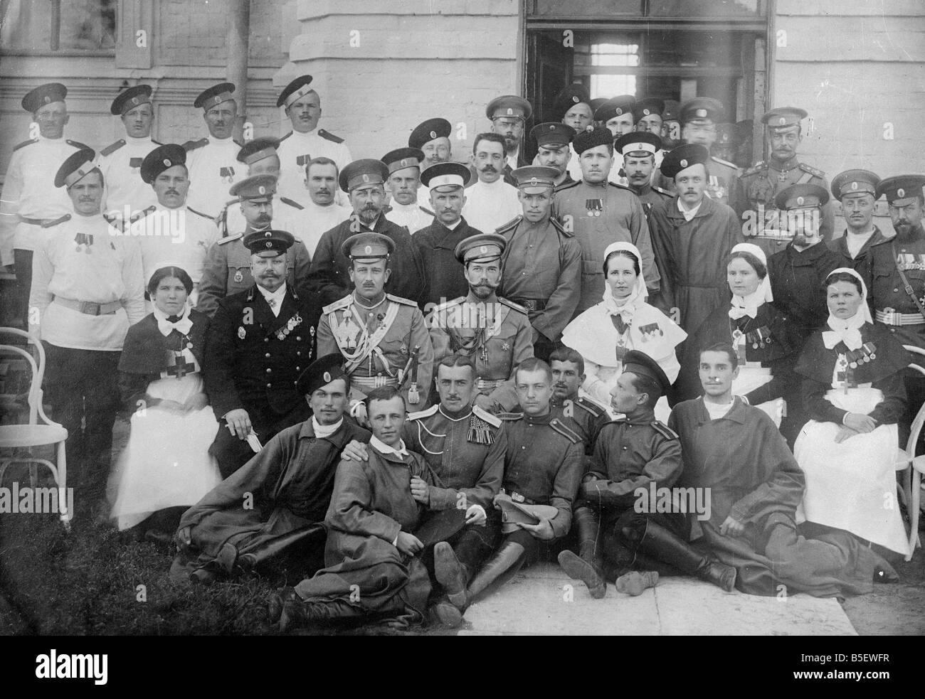 The Tsar seen here with nurses and patients at a Petrograd hospital ...