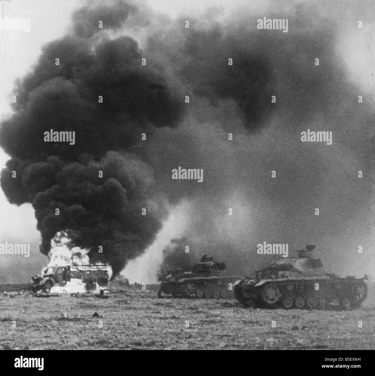 Enemy tanks ablaze during a battle in Cyrenaica in Libya during the ...