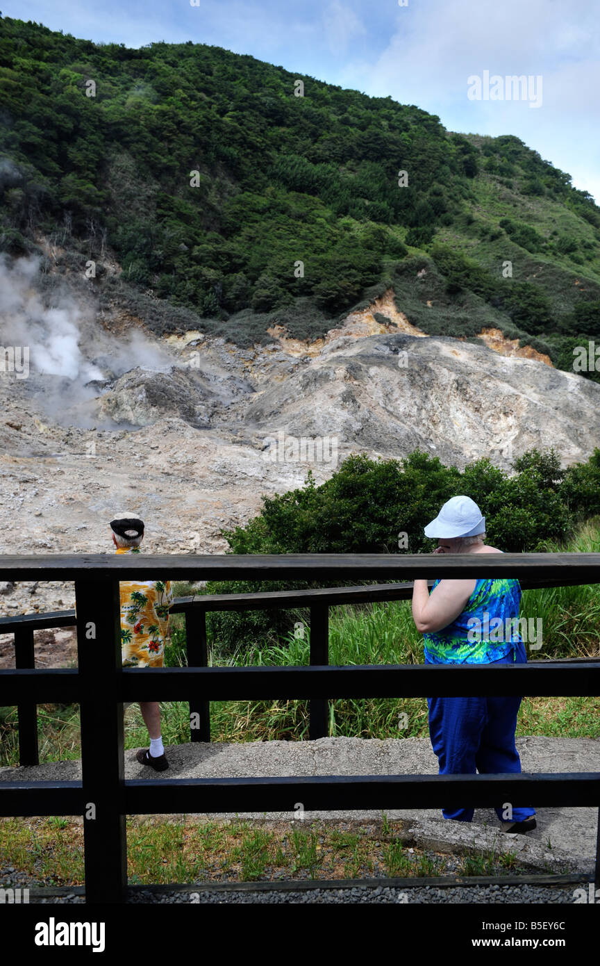 A TOURIST COUPLE VISITING THE SULPHUR POOLS IN THE CRATER OF MOUNT ...