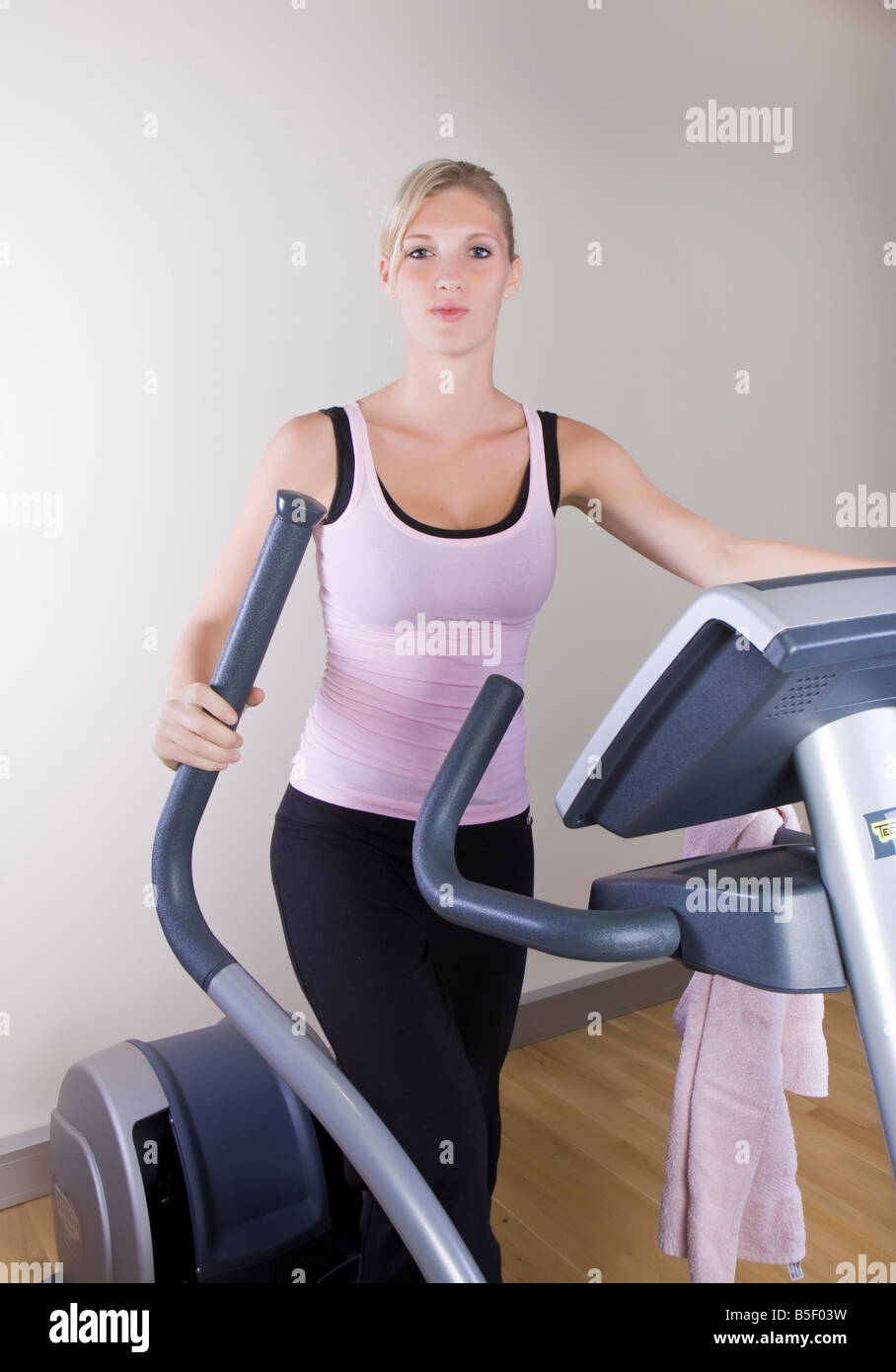 young woman training on Stairmaster Stock Photo - Alamy