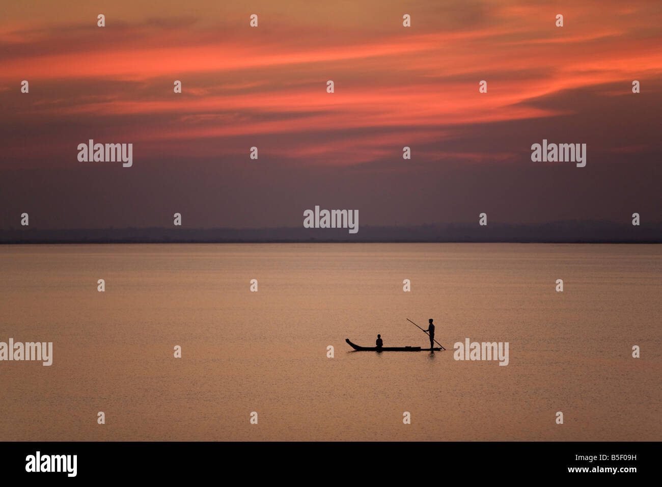 Fishing at sunset Stock Photo - Alamy