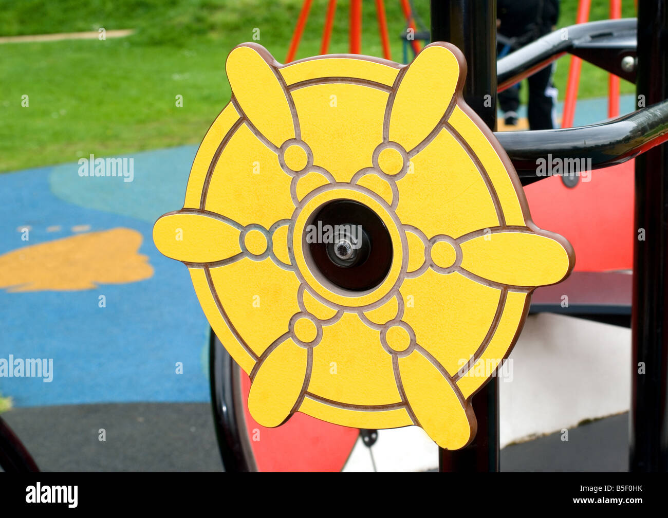 Yellow helm in a playground in UK Stock Photo - Alamy
