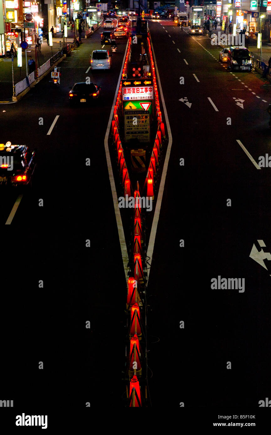 Cars and traffic cones at night in Shibuya, Tokyo, Japan Stock Photo ...