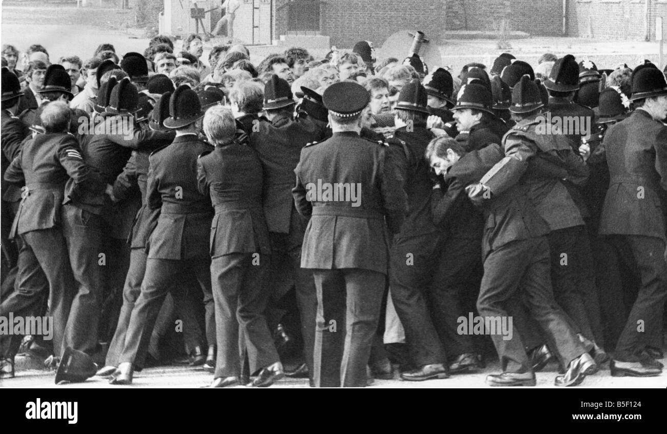A group of police officers hold back a crowd circa 01 06 84 Stock Photo ...