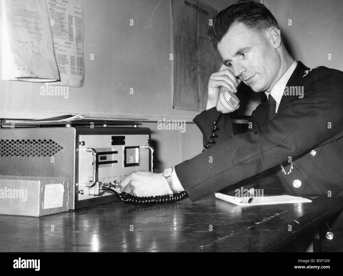 Police Officer Derek Baty working at the telephone control station ...
