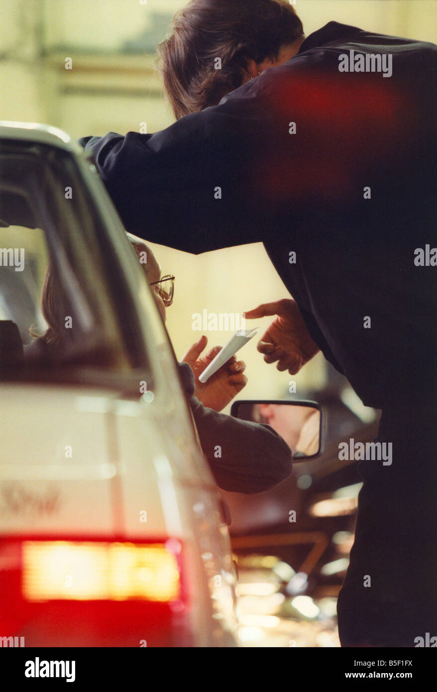 A picture posed by models of police informant a grass being paid for ...