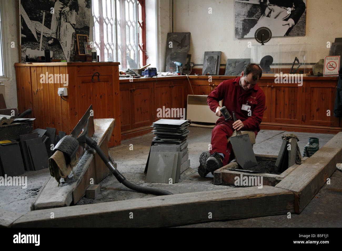 Craftsman giving a demonstration of slate splitting at the National ...
