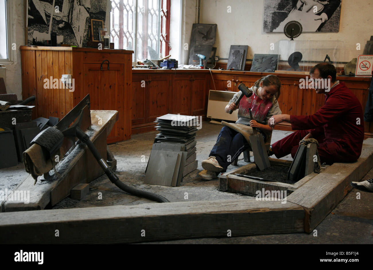 Craftsman giving a demonstration of slate splitting at the National ...