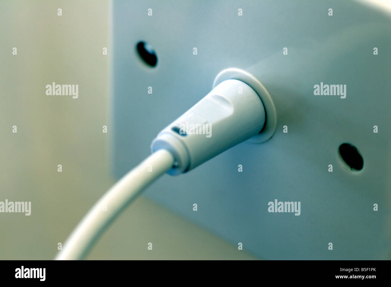 Aerial plugged into wall socket close up Stock Photo - Alamy