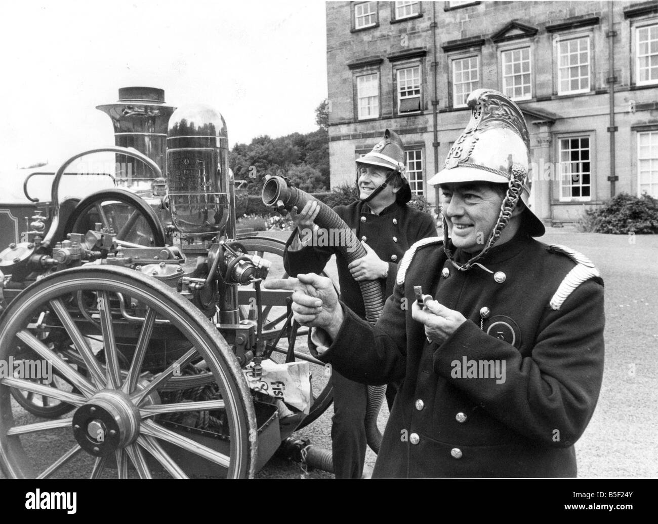Goeff and Robin dressed as Victorian Firefighters with a fire engine of ...