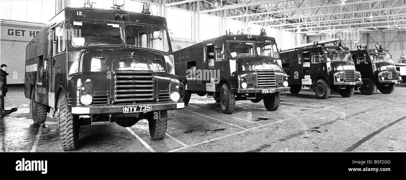 A line up of Green Goddess fire engine ready for action in the hanger ...