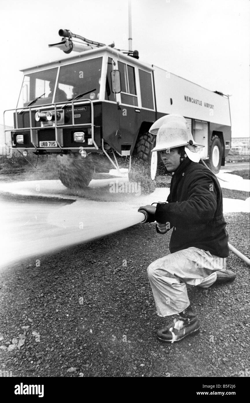 Fireman Bob Ford with the new fire engine at Newcastle Airport Stock ...