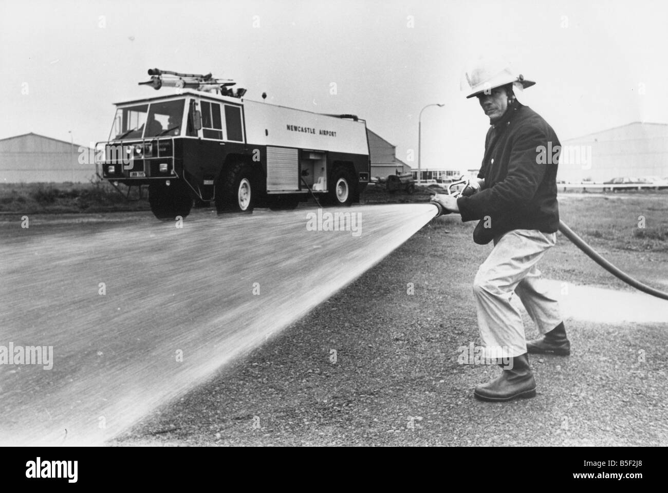 Fireman Bob Ford with the new fire engine at Newcastle Airport Stock ...