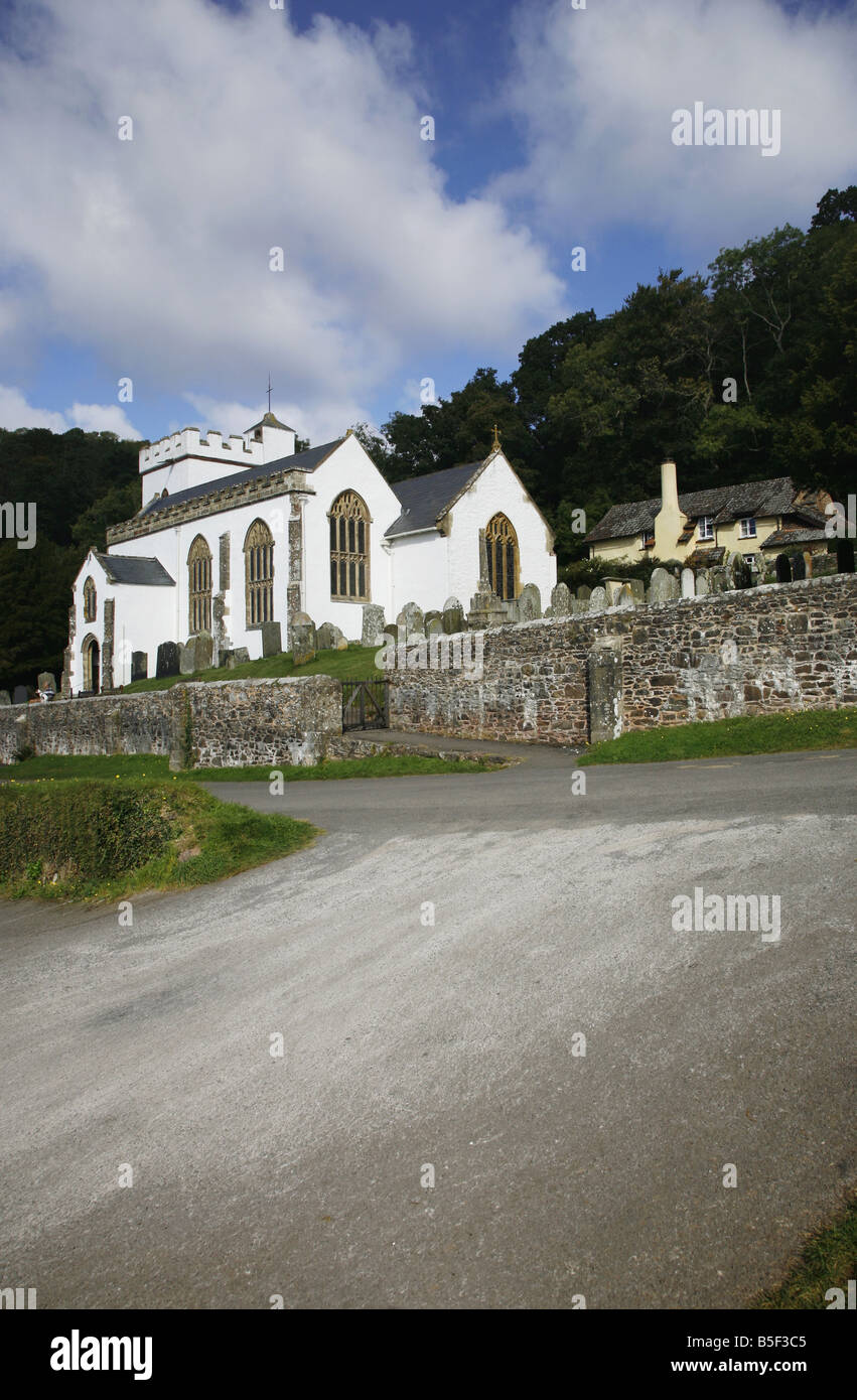 The white washed 15th century church of All Saints in the picturesque ...