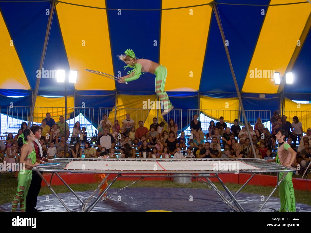 Circus performers on a trampoline Stock Photo - Alamy