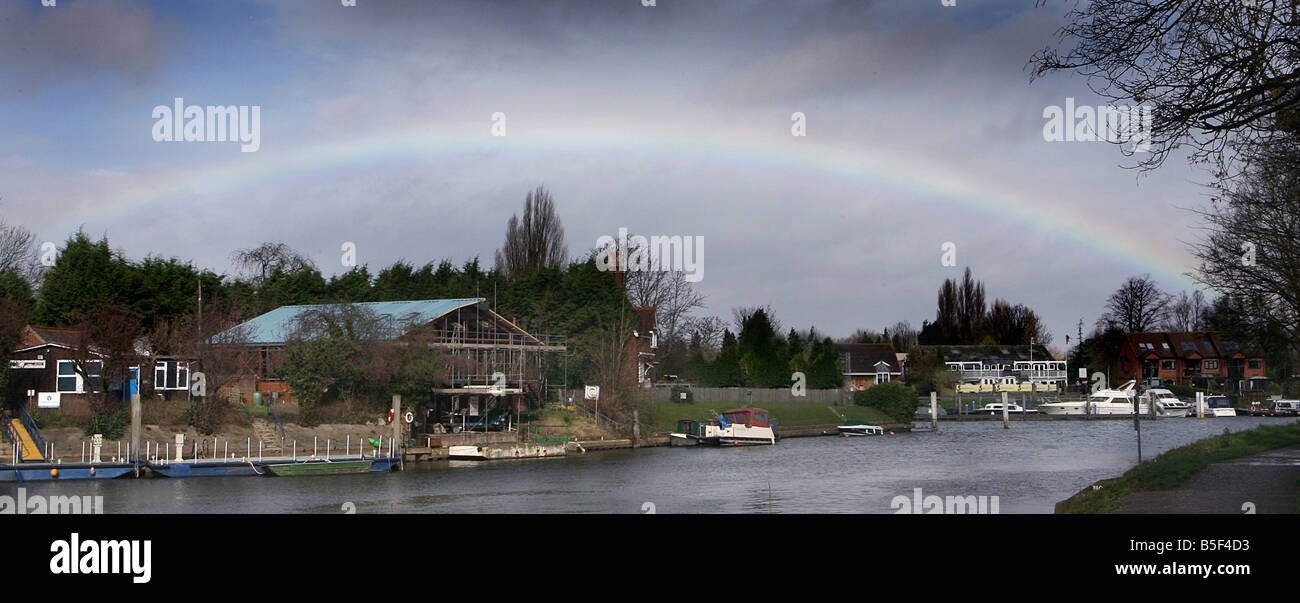A rainbow momentarily forms over river thames at weybridge hi-res stock ...