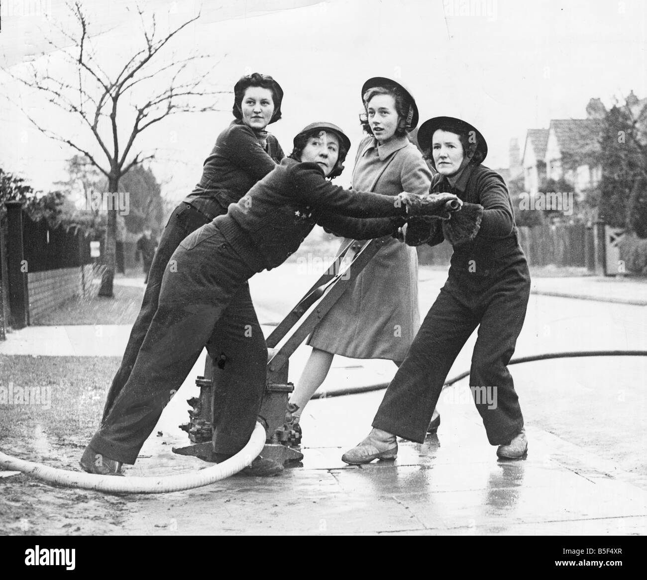 Women firefighters in action. 23rd January 1941 Stock Photo - Alamy