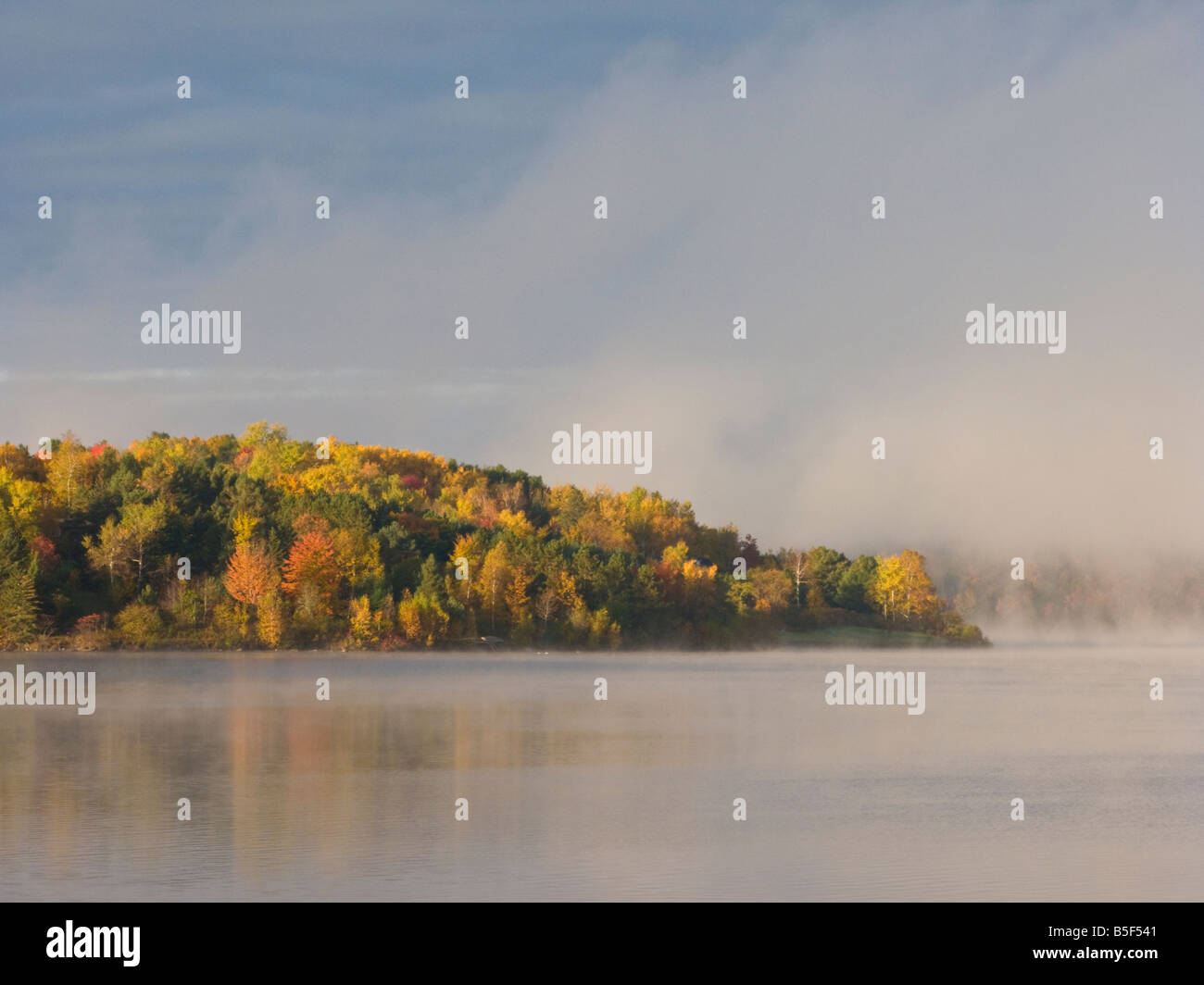 Heavy morning fog along the St John River during the fall with fall ...