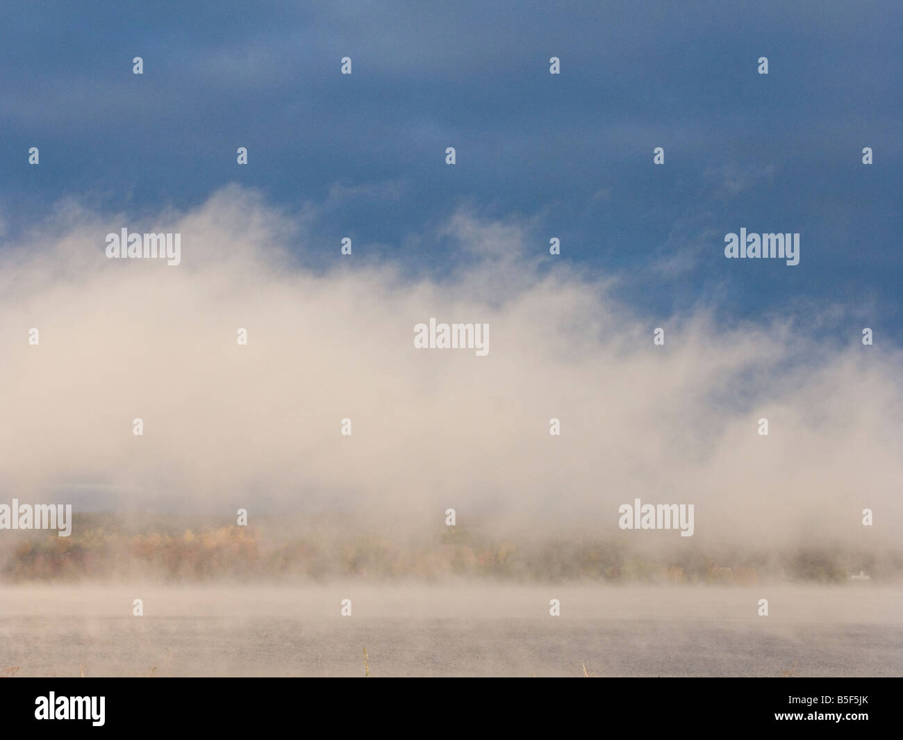 Heavy morning fog along the St John River during the fall with fall ...
