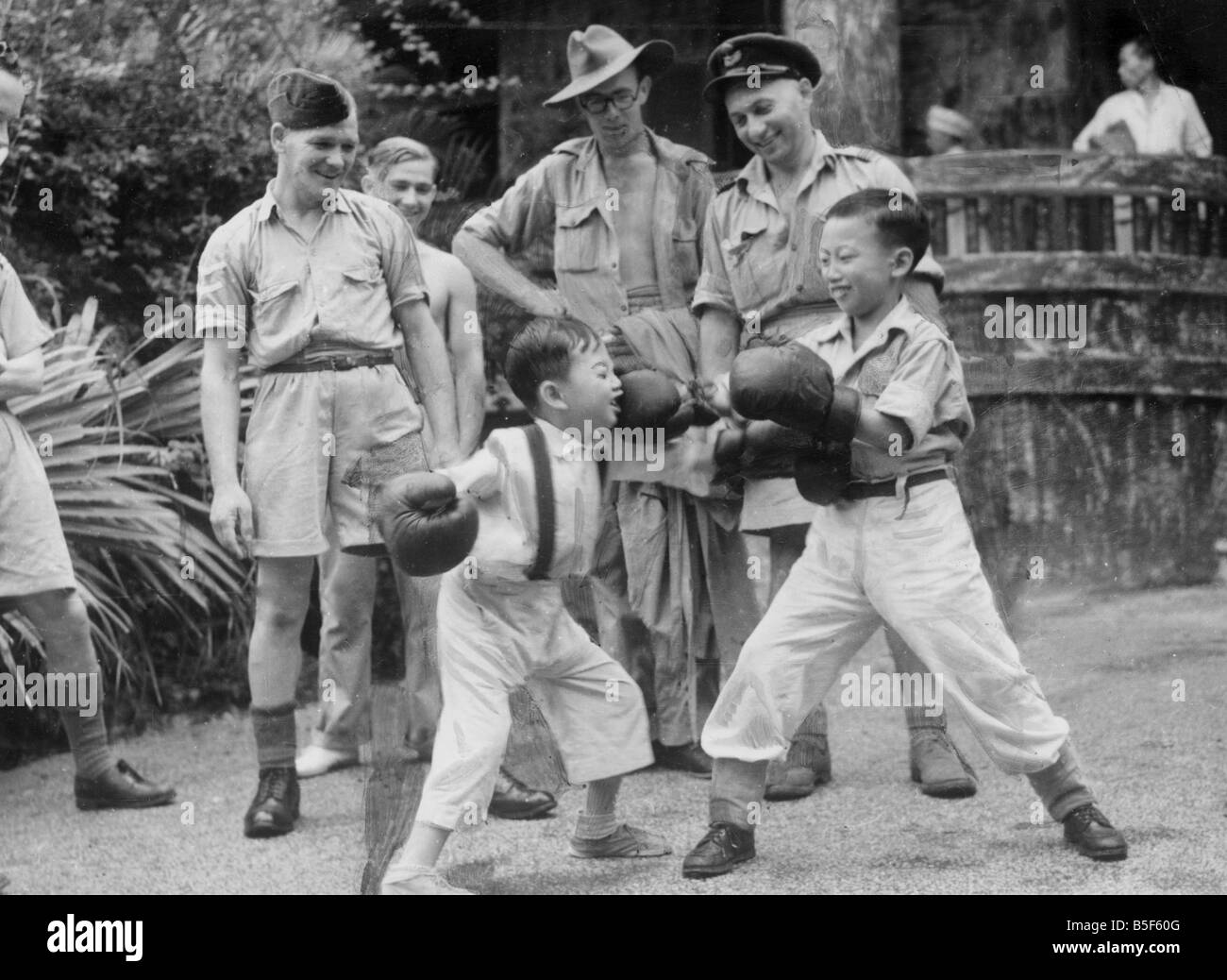 Chinese children taken under the wing of RAF officers having a boxing ...