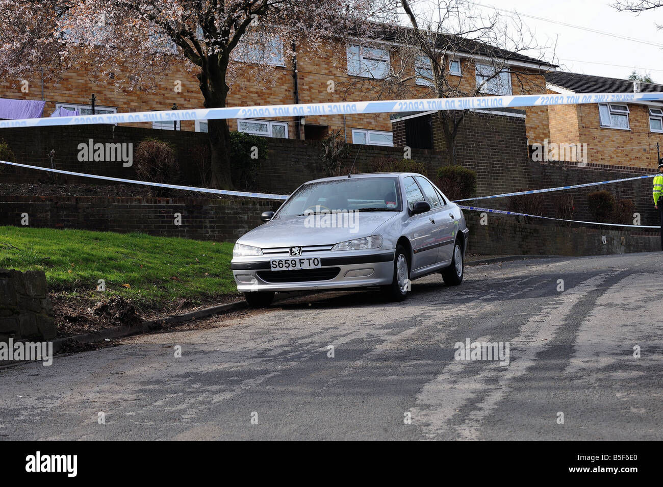Police guard the flat in Lidgate Gardens in Dewsbury West Yorks where ...