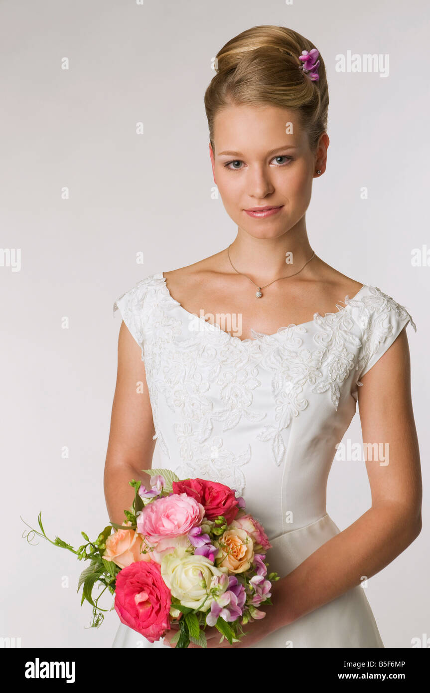 Young bride holding bridal bouquet, portrait Stock Photo - Alamy