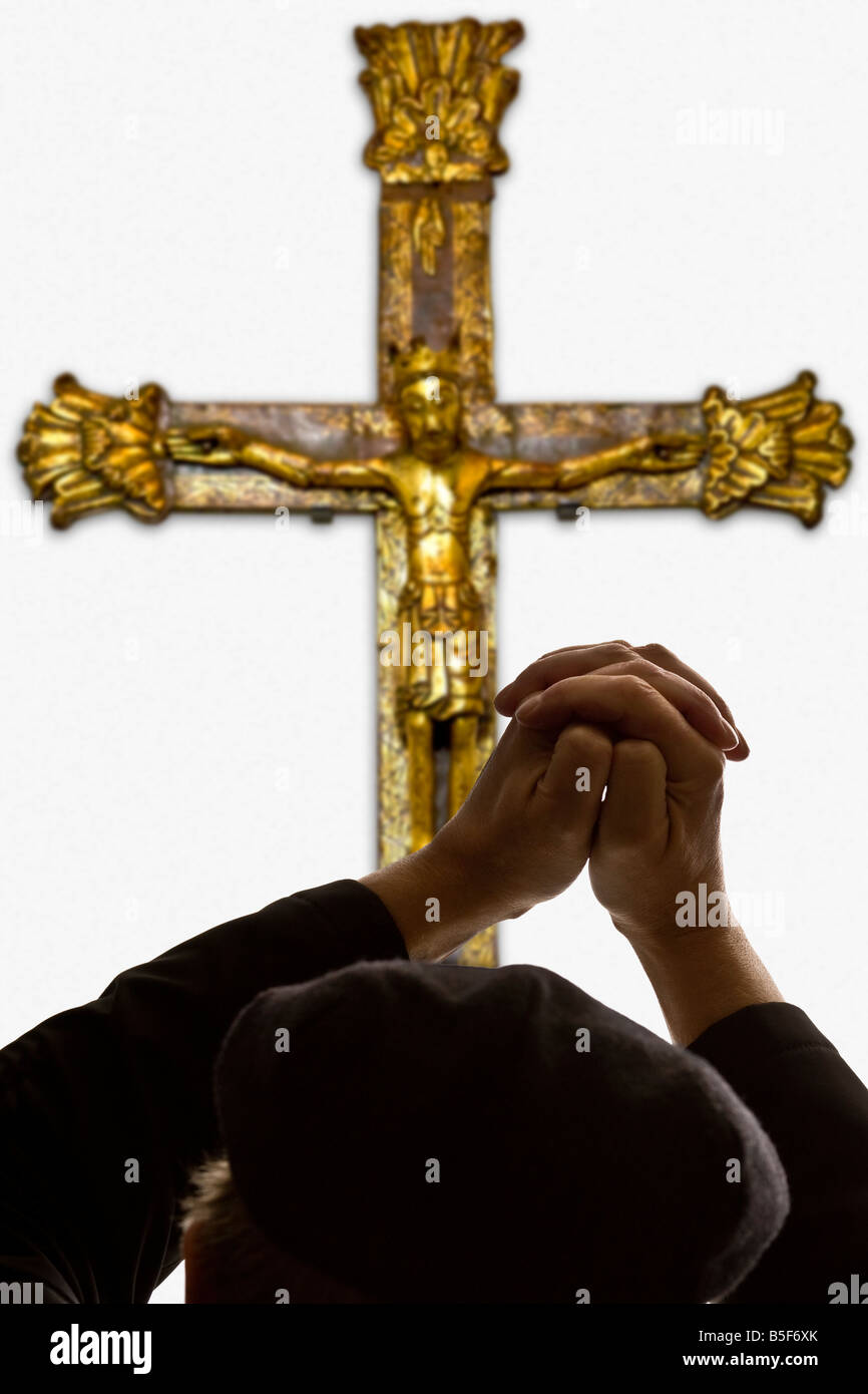 Man praying in front of crusifix Stock Photo - Alamy