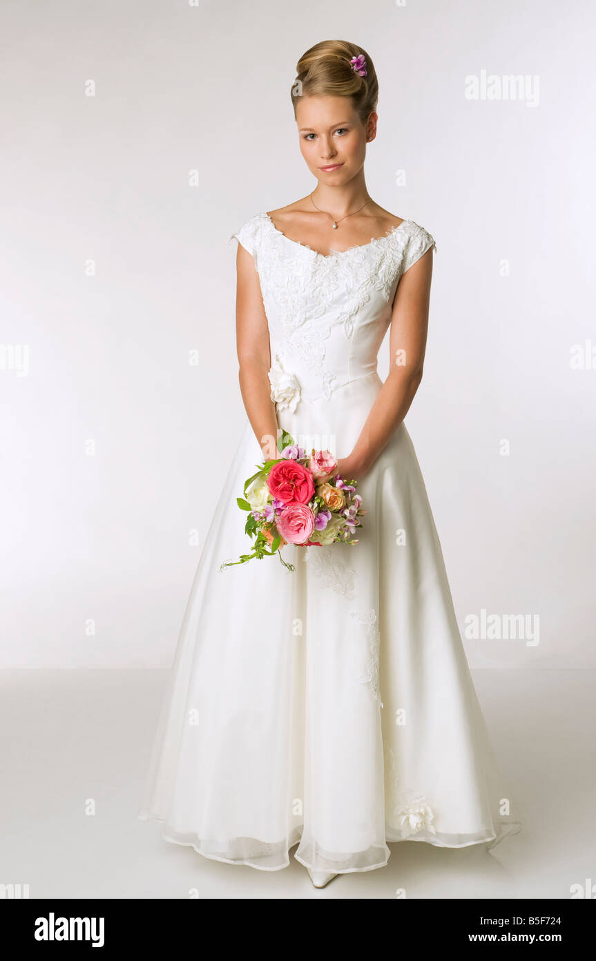Young bride holding bridal bouquet Stock Photo - Alamy
