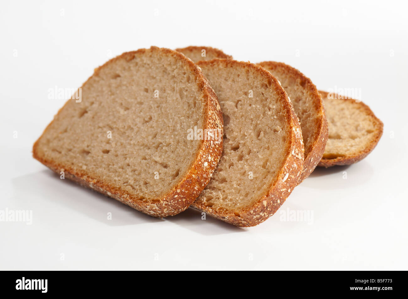 slices of whole wheat bread on light background Stock Photo - Alamy