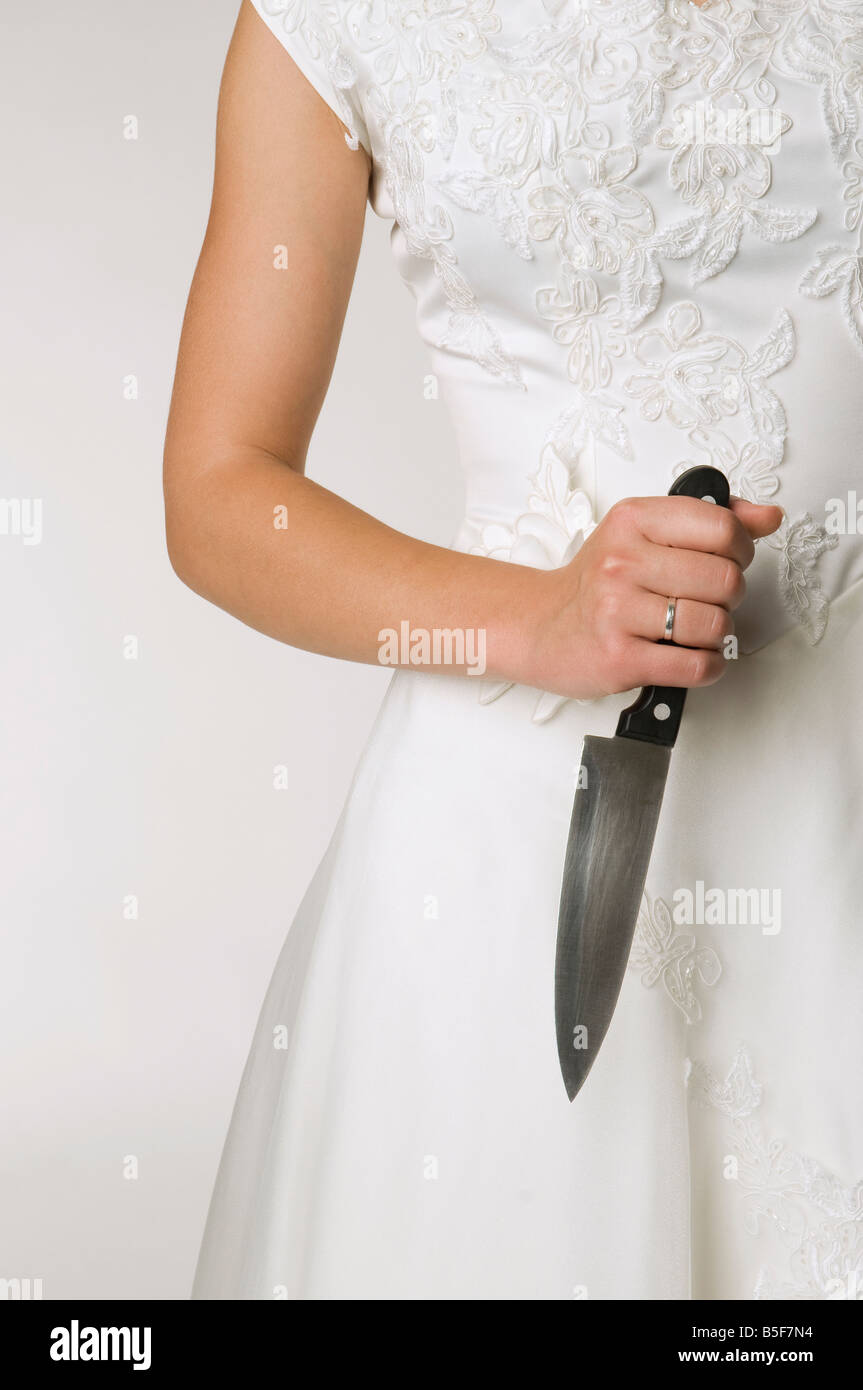 Bride holding knife, close-up Stock Photo - Alamy