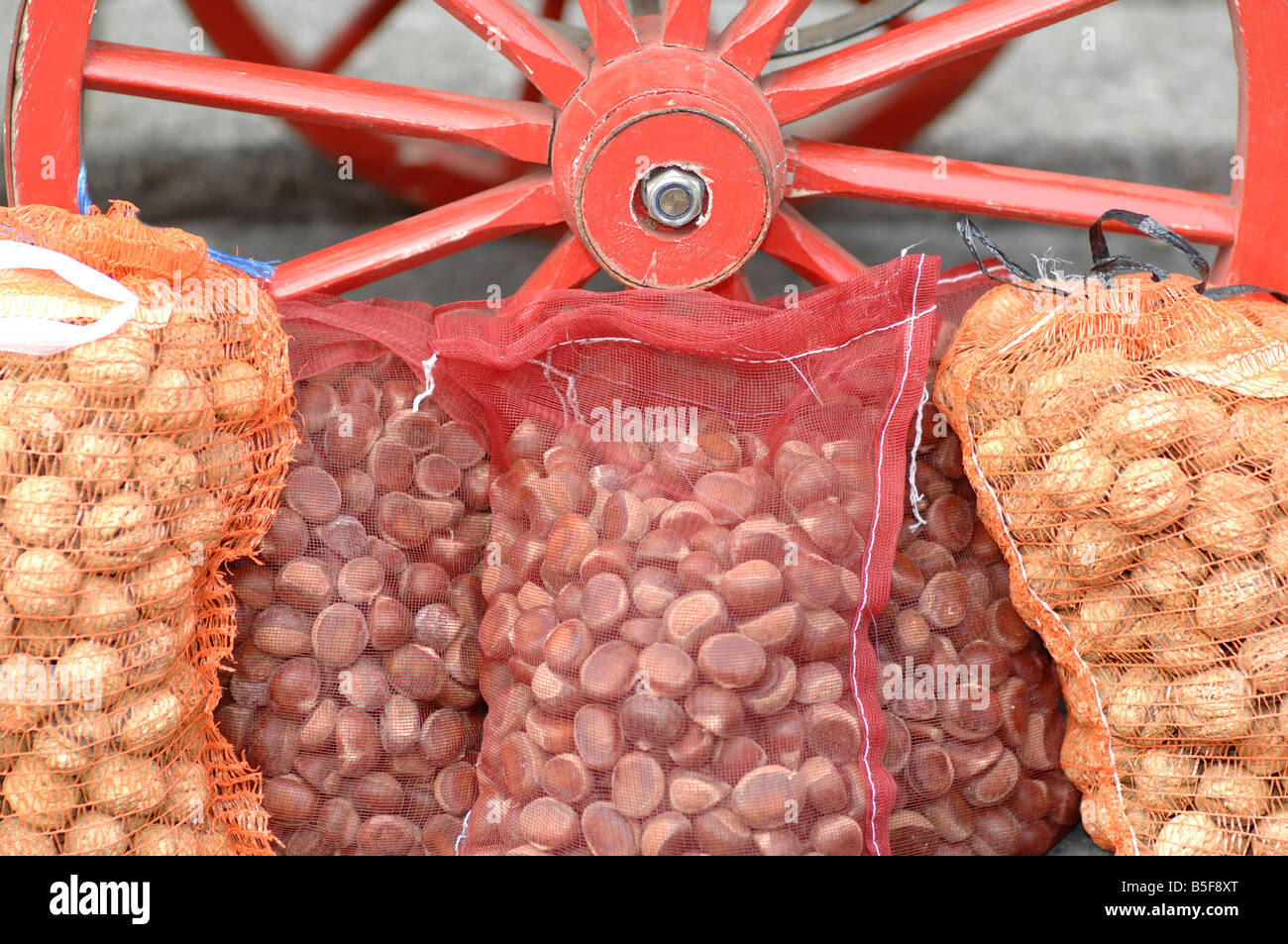 Nuts for sale next to a cart Stock Photo - Alamy