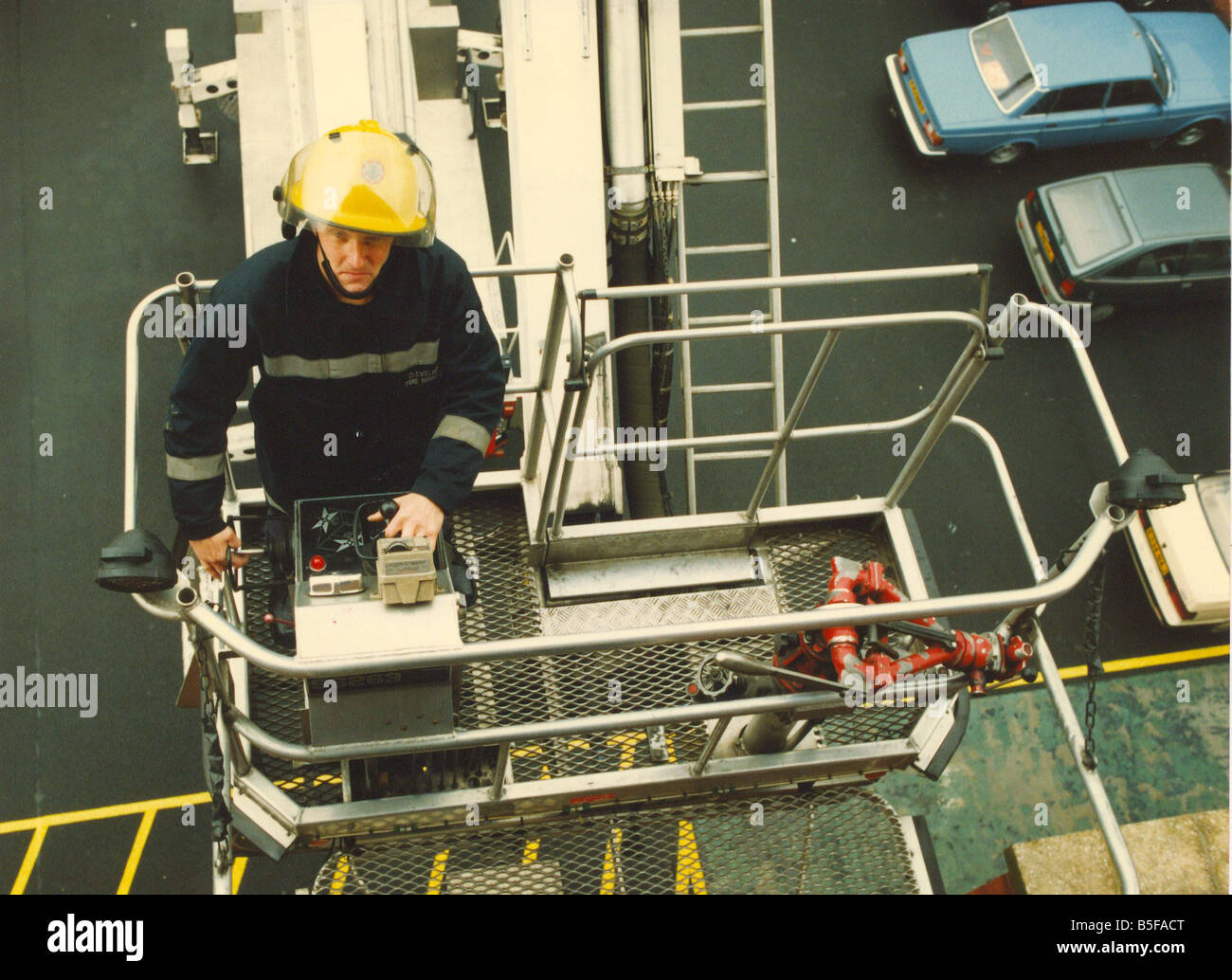 Firefighters practice rescue routines using one of their turntable ...