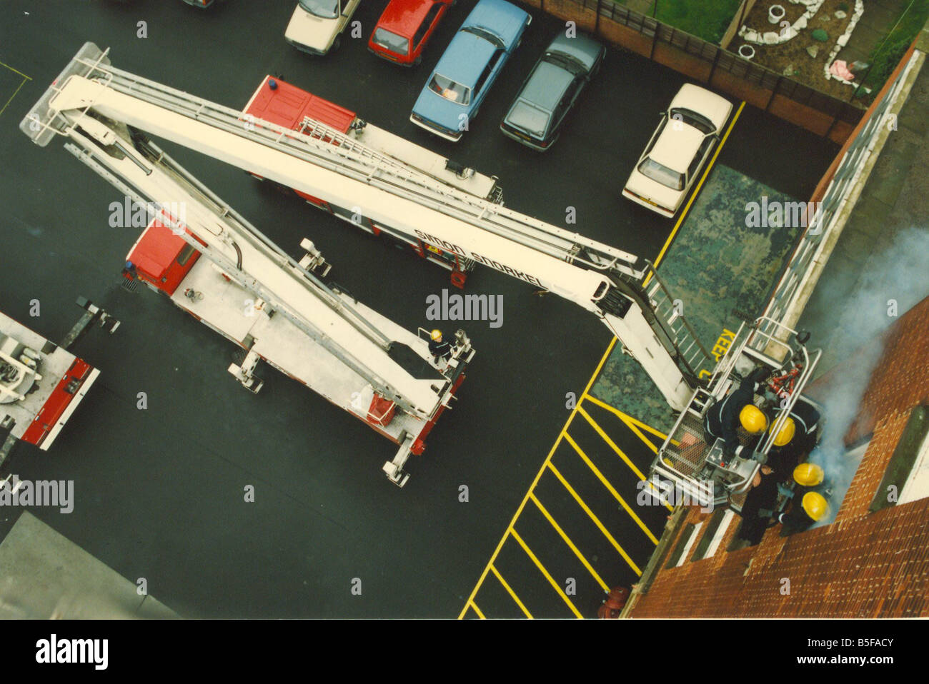 Firefighters practice rescue routines using one of their turntable ...