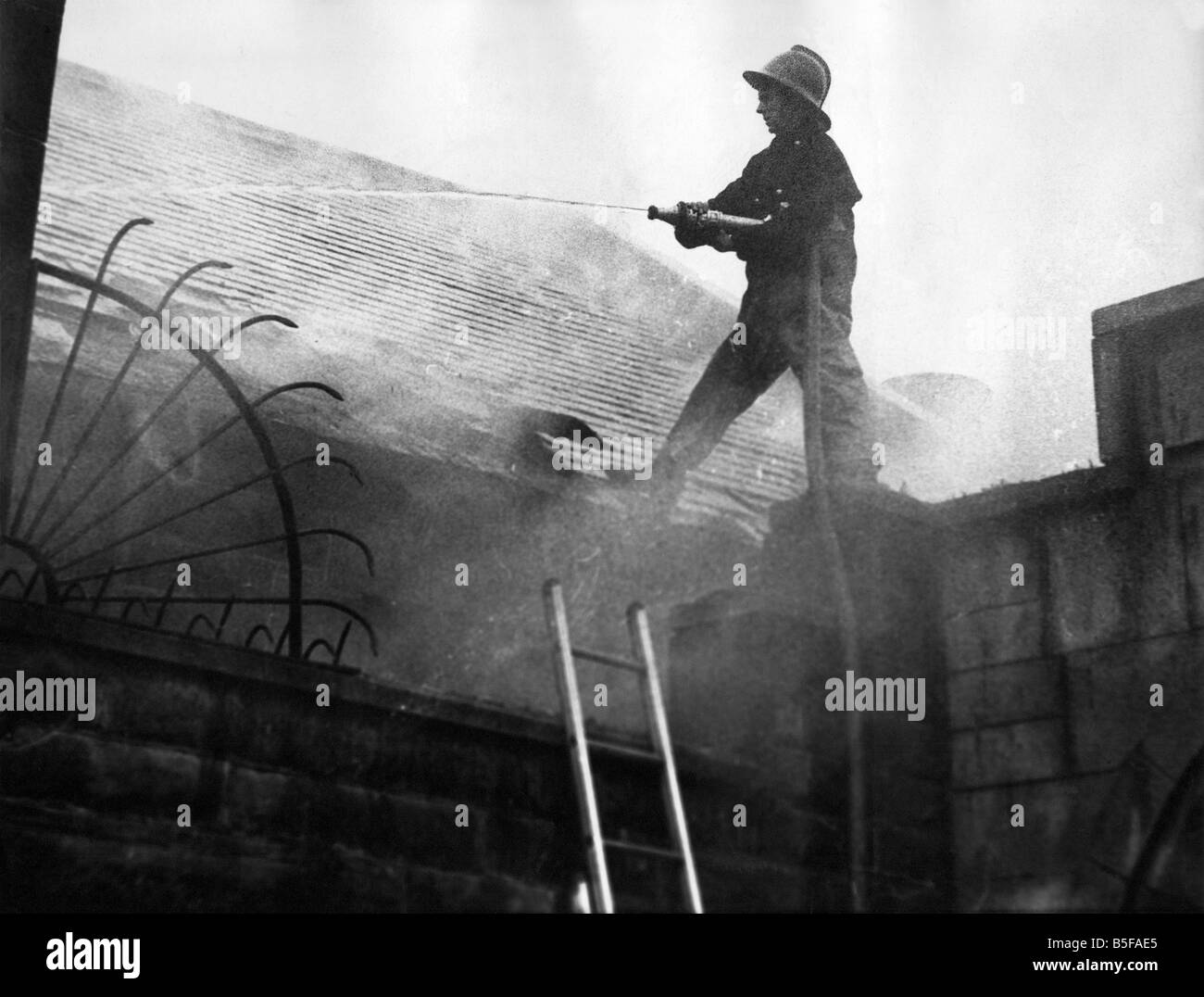 Firefighters clambered over the roofs high above the city to tackle a ...