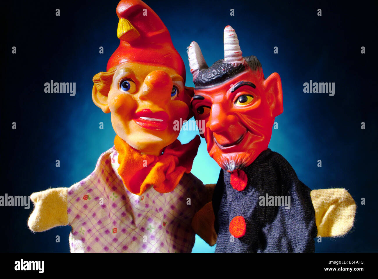 A devil and a Punch hand puppet Stock Photo - Alamy