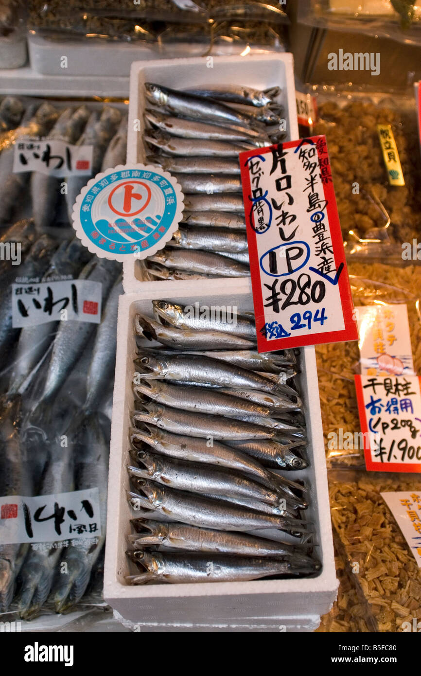 Fish are sold at a street market in the Tsukiji District of Tokyo ...