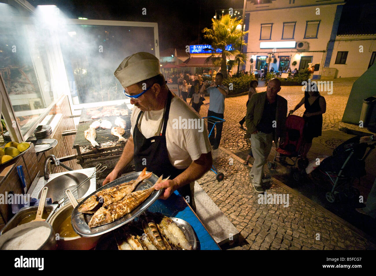 Grilling fish in alvor algarve portugal hi-res stock photography and ...