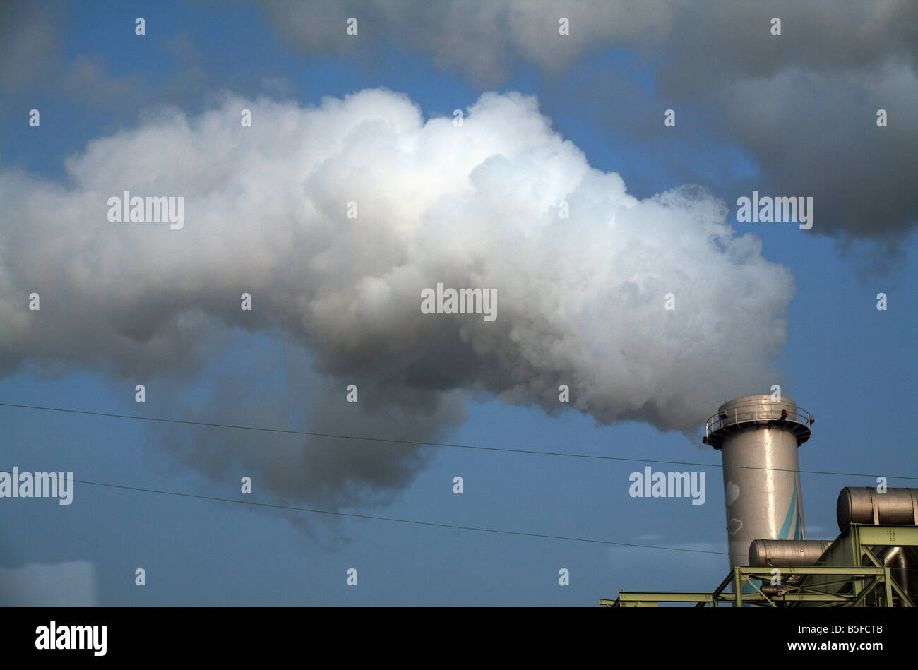 Smoky factory chimney Stock Photo - Alamy